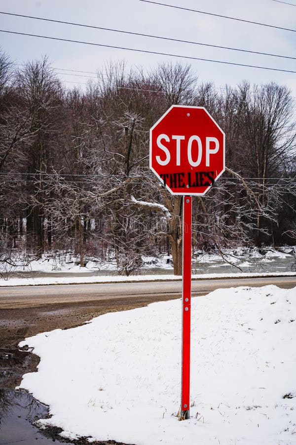 A Stop Sign at the End of a Small Country Road, Spray Painted with ...