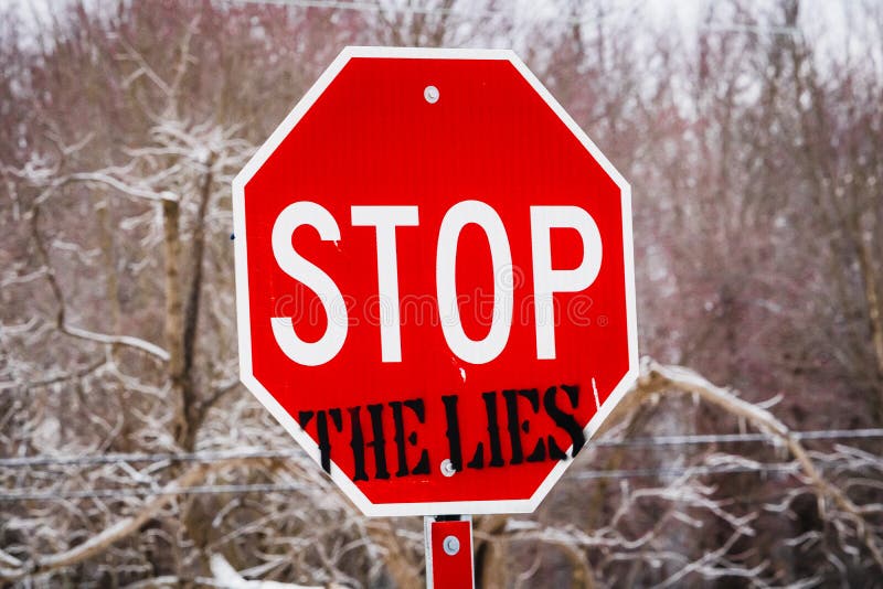 A Stop Sign at the End of a Small Country Road, Spray Painted with ...