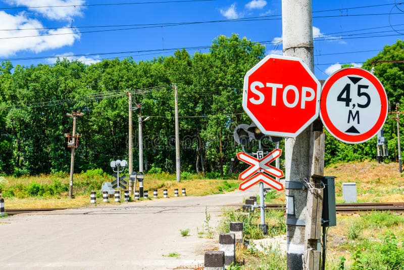 Stop Sign in Front of the Railroad Crossing Stock Image - Image of ...