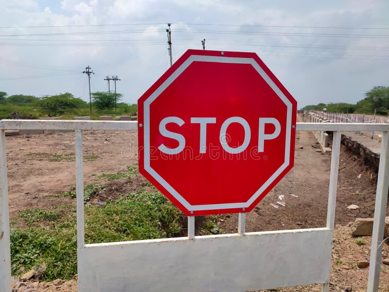 Stop sign at the highway stock photo. Image of tree - 256795430