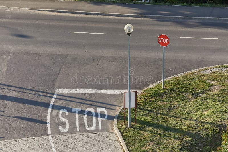 Stop Sign at an Intersection Stock Photo - Image of surface, road ...