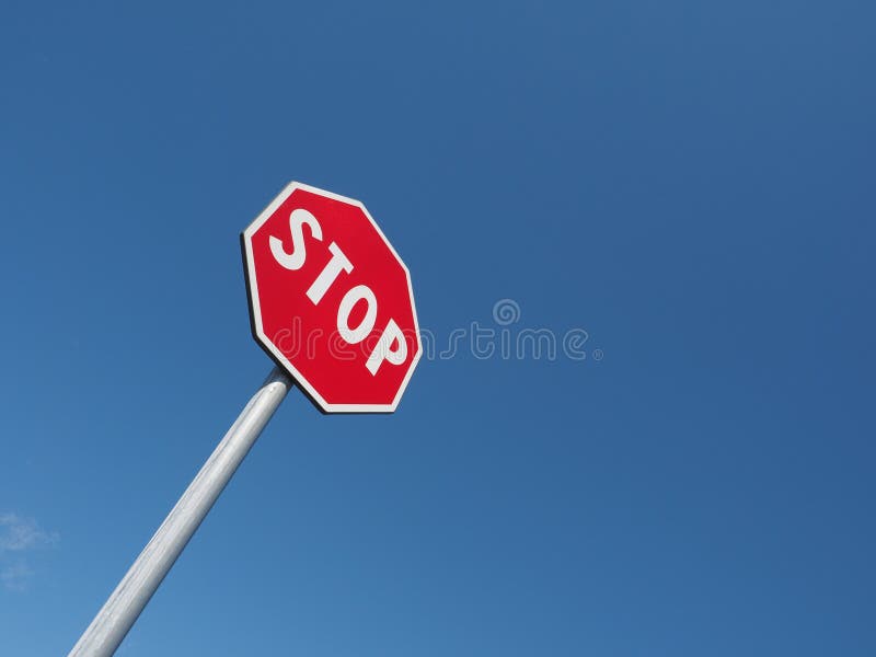 Stop sign over blue sky stock photo. Image of blue, signal - 145696866