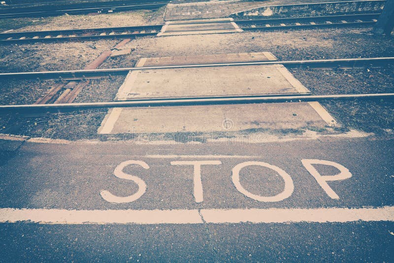 Stop Sign Painted in Front of Railroad Tracks. Stock Photo - Image of ...