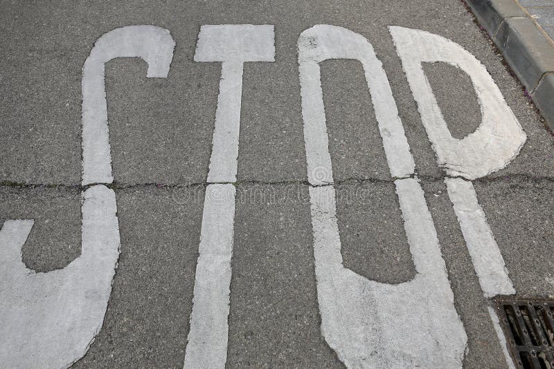 Stop Sign Painted on the Road Stock Photo - Image of street, vehicle ...