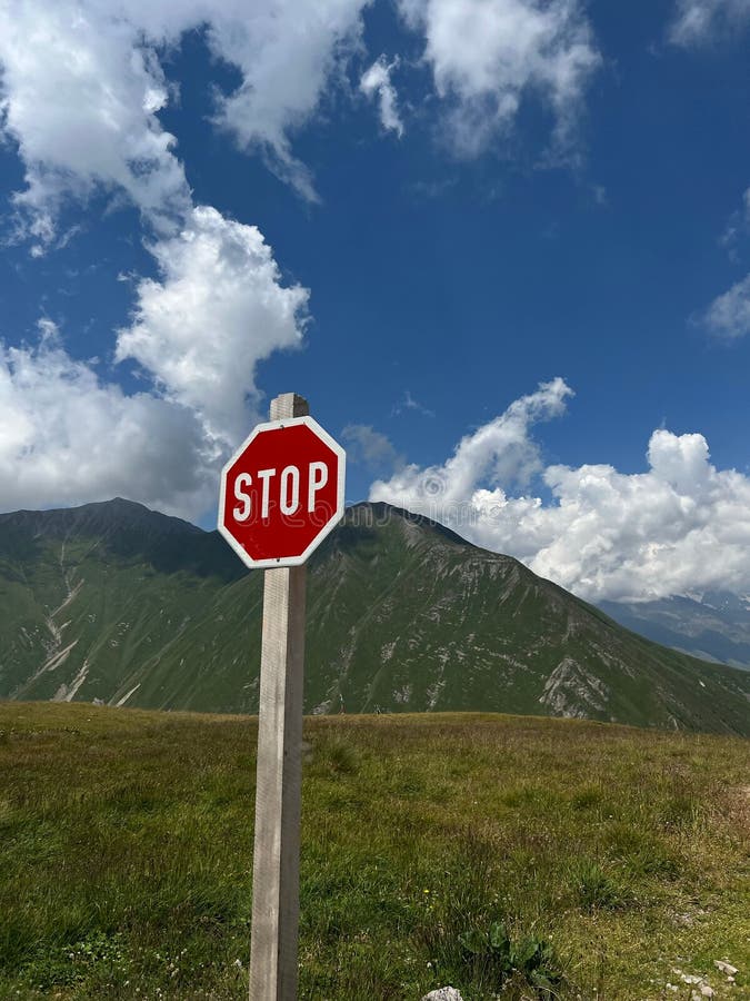 Stop Sign Post Against Mountain Landscape in the Counryside Stock Photo ...