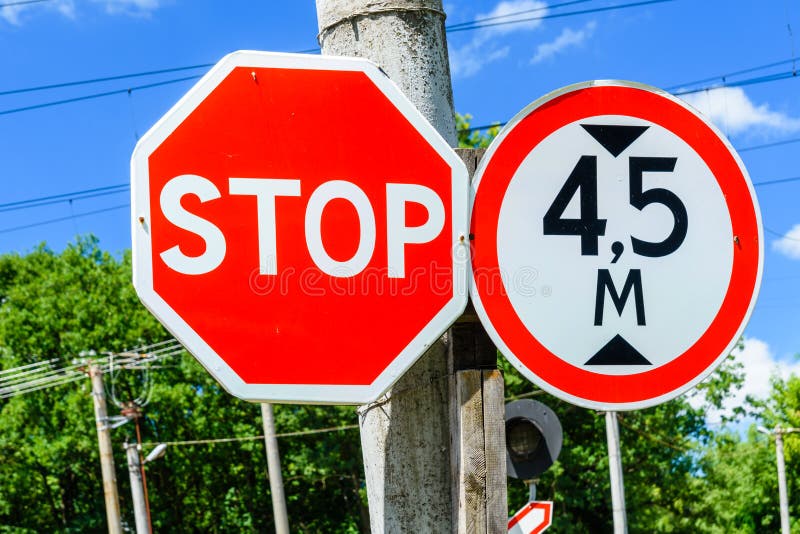 Stop Sign on a Post at Roadside Against Blue Sky Stock Photo - Image of ...
