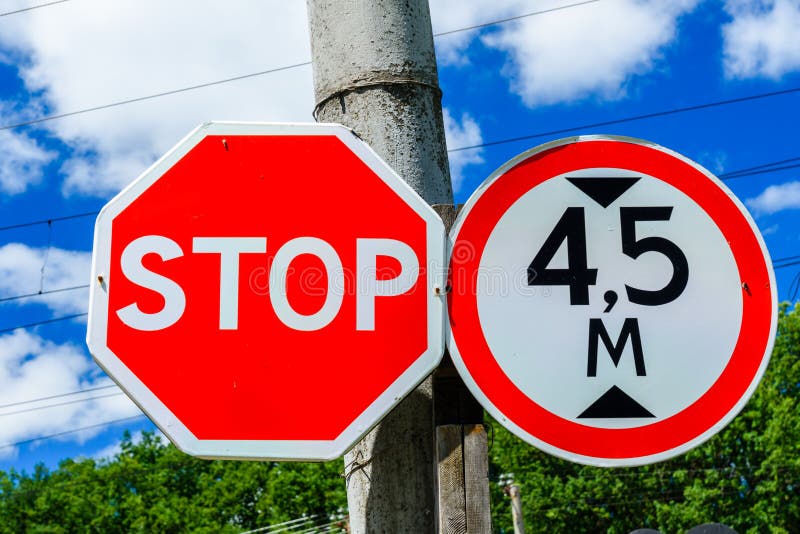 Stop Sign on a Post at Roadside Against Blue Sky Stock Image - Image of ...
