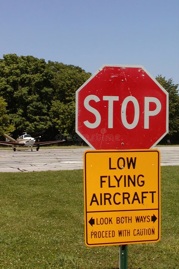 Caution Sign for Low Flying Aircraft Near Runway with a Small Plane in ...