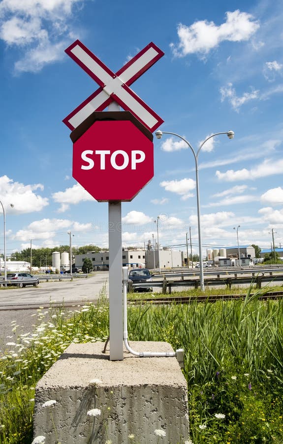 Stop Sign at a Railway Crossing Stock Photo - Image of sign, foliage ...