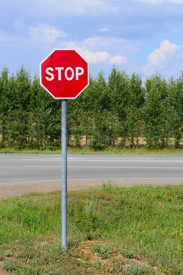 Stop sign on the road stock photo. Image of trip, speed - 75184618
