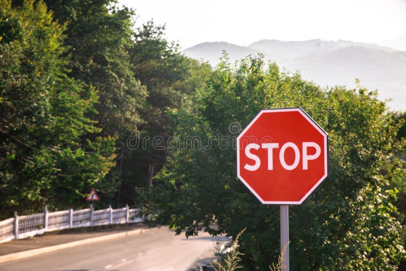 Stop sign in the road stock image. Image of information - 244371201