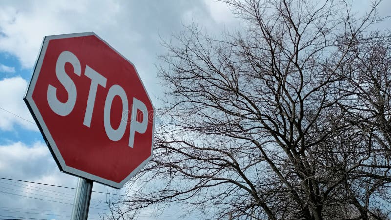 A Stop Sign Set Against a Dramatic Cloudy Sky Serving As a Visual ...