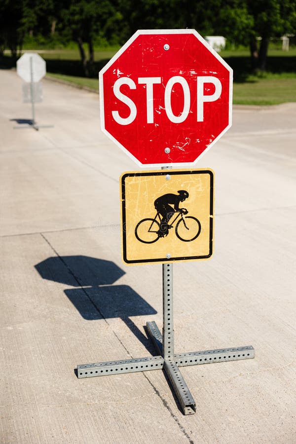 Stop Sign with Sticker and Man on Bicycle Stock Image - Image of ...