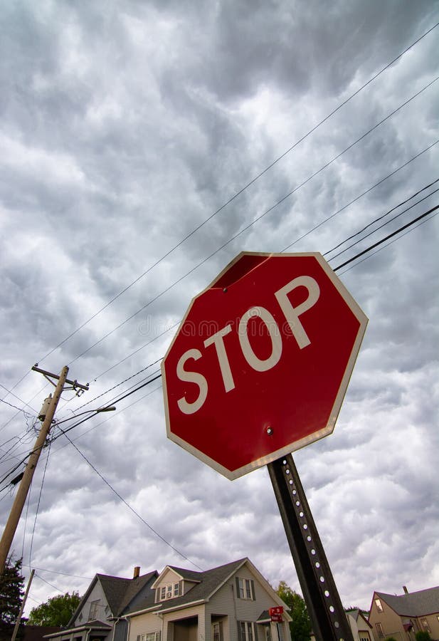 Stop Sign with Storm Clouds Stock Image - Image of blue, clouds: 147944145