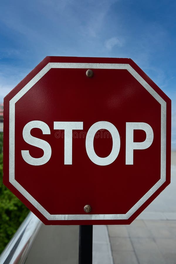 Stop Sign in the Street Blue Sky Background Stock Photo - Image of ...