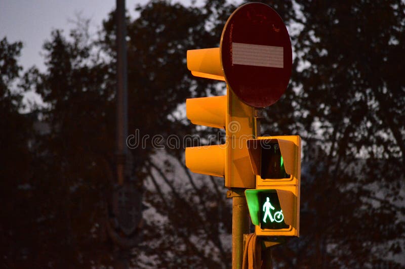 Stop Sign and Traffic Light Showing a Green Light for Pedestrians Stock ...
