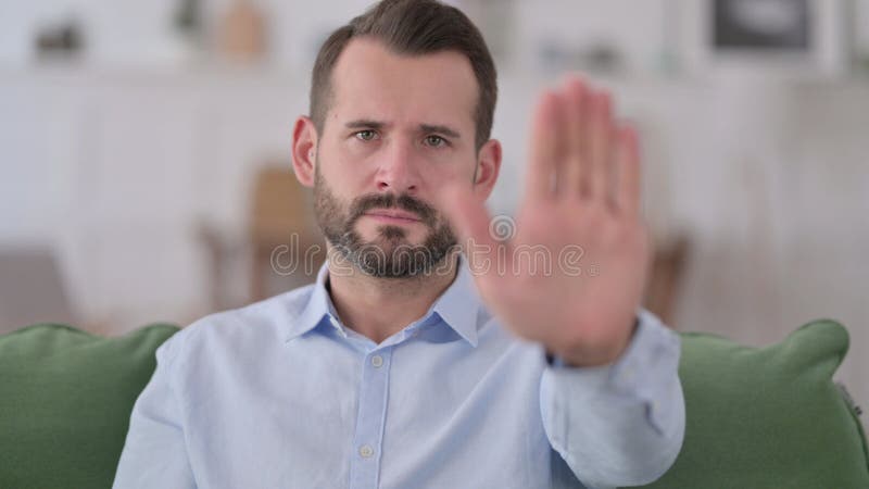 Stop Sign by Young Man in Disapproval, No Stock Image - Image of ...