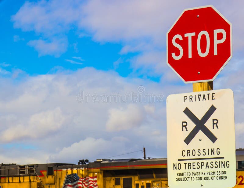 Stop SignAt Private Railroad Crossing with Train in Background Stock ...