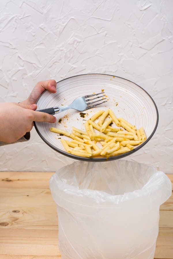 Stop Wasting Food. Leftover Lunch is Dumped in the Bin Stock Photo ...