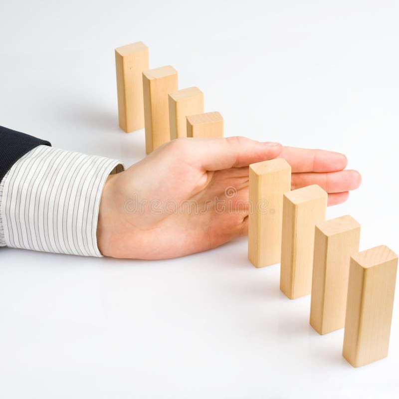 Stopping the domino effect stock photo. Image of finger - 33768292