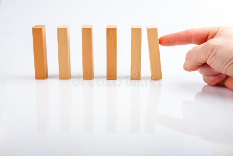 Stopping the domino effect stock image. Image of manager - 88819807