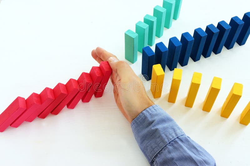 Stopping the Domino Effect. Executive and Risk Control Concept Stock ...
