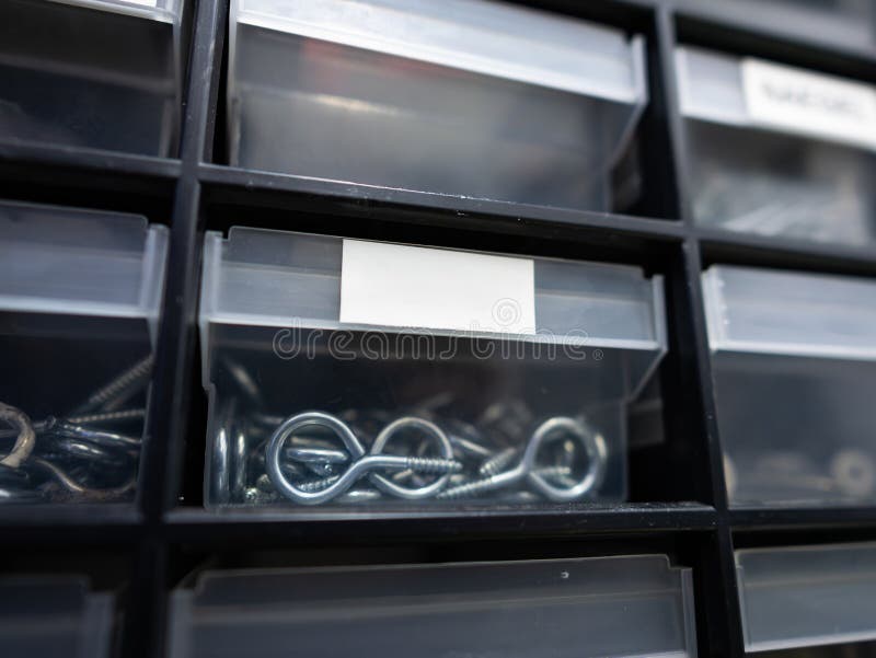 Storage Box in a Workshop with an Empty White Label Stock Photo - Image ...