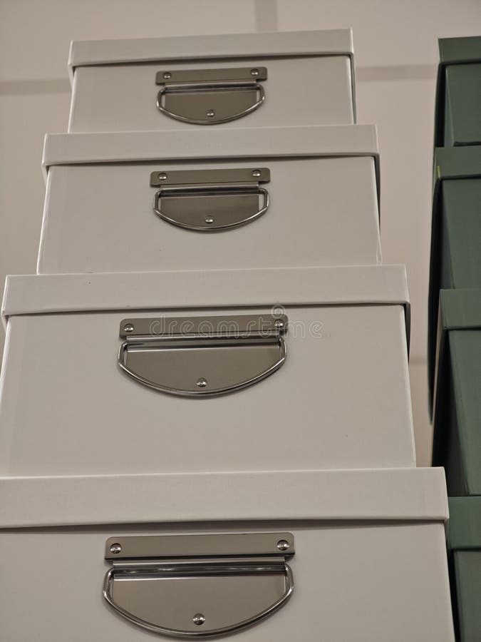 Storage Boxes Arranged Neatly in a Stack with Metallic Handles in a ...