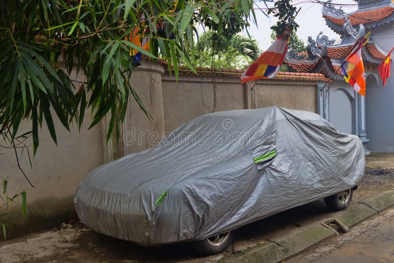 The Car Under the Protective Cover is in the Showroom Stock Photo ...