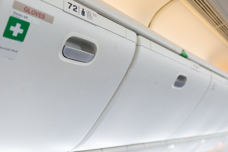 Storage Compartment in a Airplane Stock Image - Image of economy ...