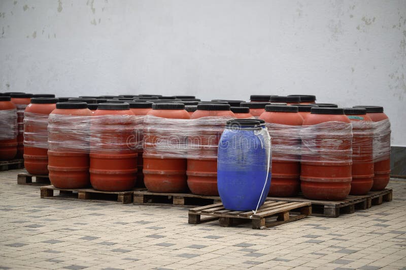 Storage of Jars and Barrels by the Barn on Pallets Stock Image - Image ...