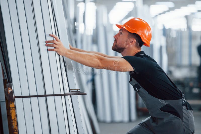 In the Storage with Many of Objects. Industrial Worker Indoors in ...