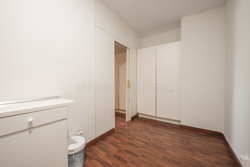 Storage Room of an Empty Office with a Simple White Closet and Jatoba ...