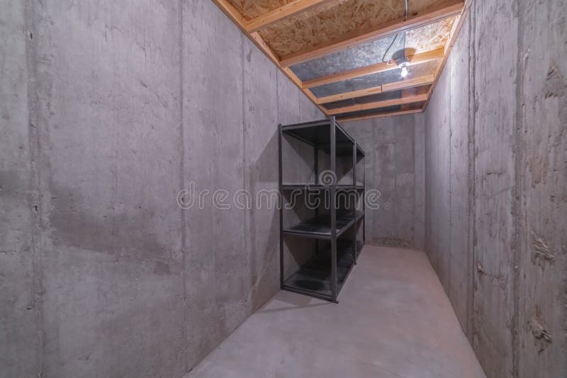 Storage Shelves in a Bare Concrete Room Stock Photo - Image of ceiling ...
