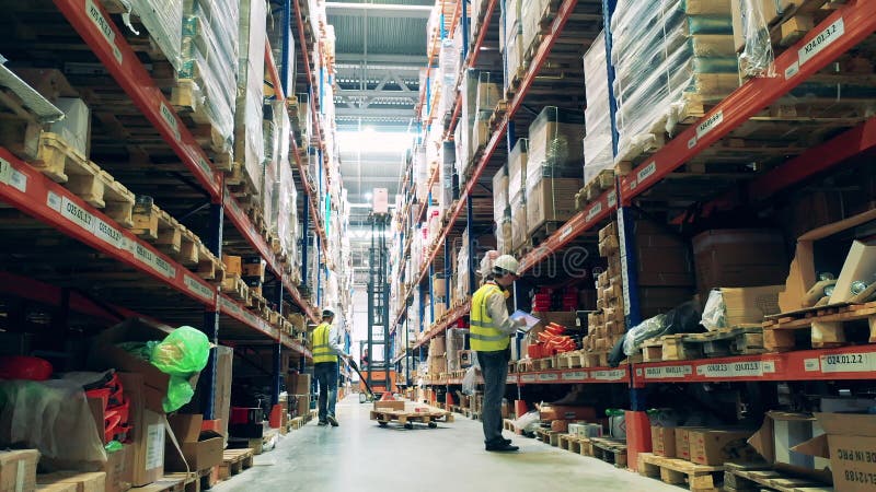 Storage Unit with Employees in Safety Uniform Stock Footage - Video of ...