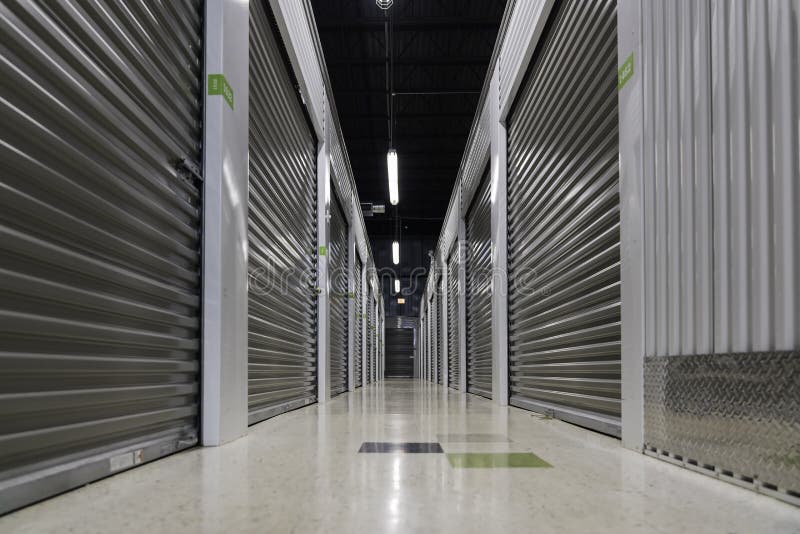 Storage Warehouse Interior. Metal Garage Doors with Locsks Stock Photo ...
