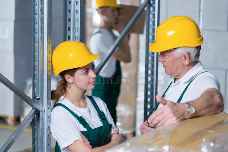 Warehouse Workers Consulting Stock Image - Image of cargo, industrial ...