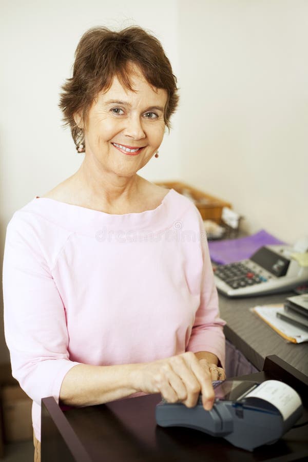 Store Clerk Runs Credit Card Stock Photo - Image of employee, manager ...