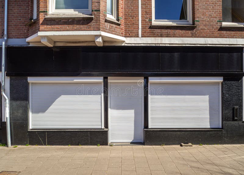Facade of a Shop with Closed Shutters Stock Photo - Image of bankrupt ...
