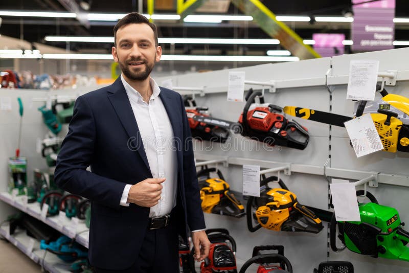 Store Manager Offers Chainsaws To Choose from Stock Photo - Image of ...