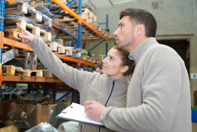 Store Manager with Warehouseman Checking Goods Reception Stock Photo ...