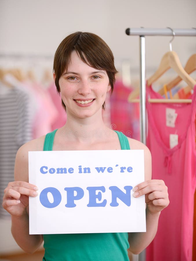 Store Owner Holding Open Sign Stock Image - Image of smile, clothing ...