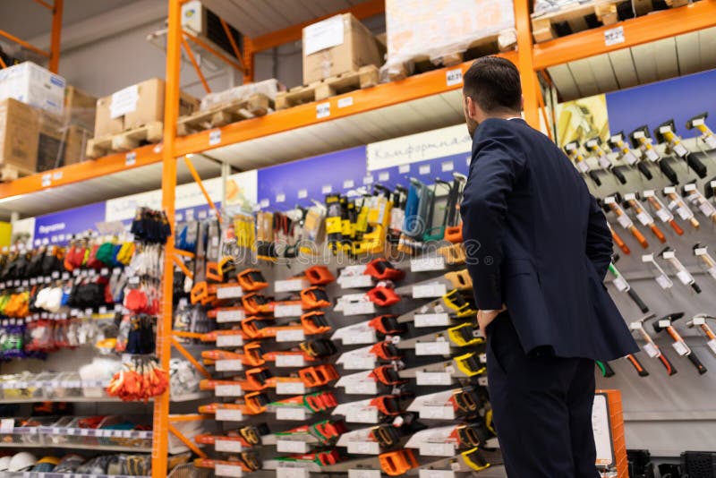 Store Owner Inspecting Shop Windows in a Construction Hypermarket Stock ...