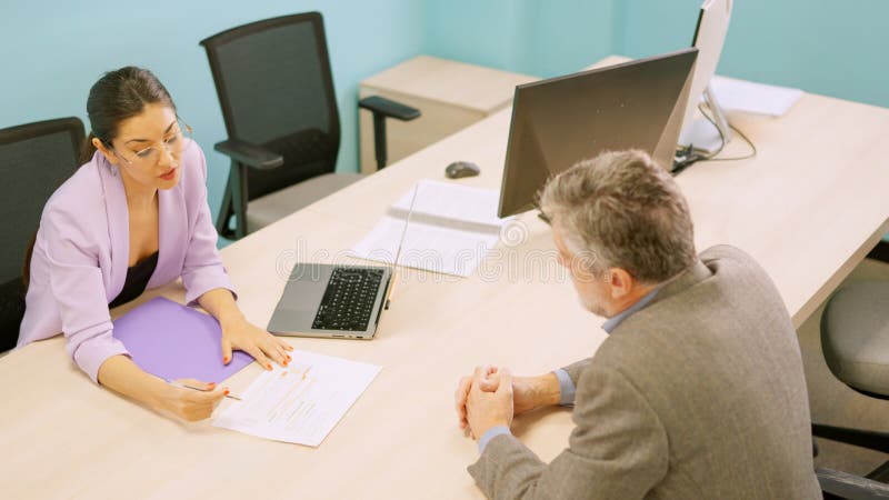 Store Saleswoman Explaining Something To a Customer Stock Photo - Image ...