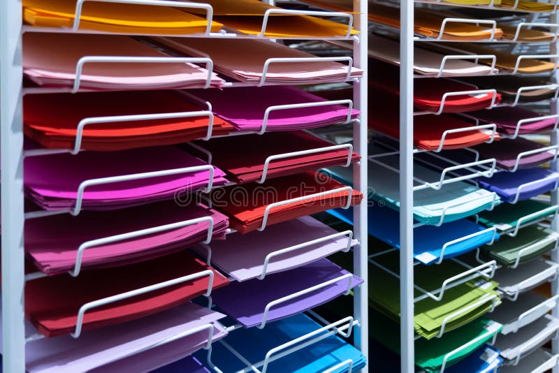 In the Store, There are Sheets of Multi-colored Paper on the Racks ...