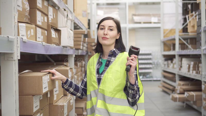 Store Worker Using Bar Code Scanner Scanning Labels on Boxes Stock ...