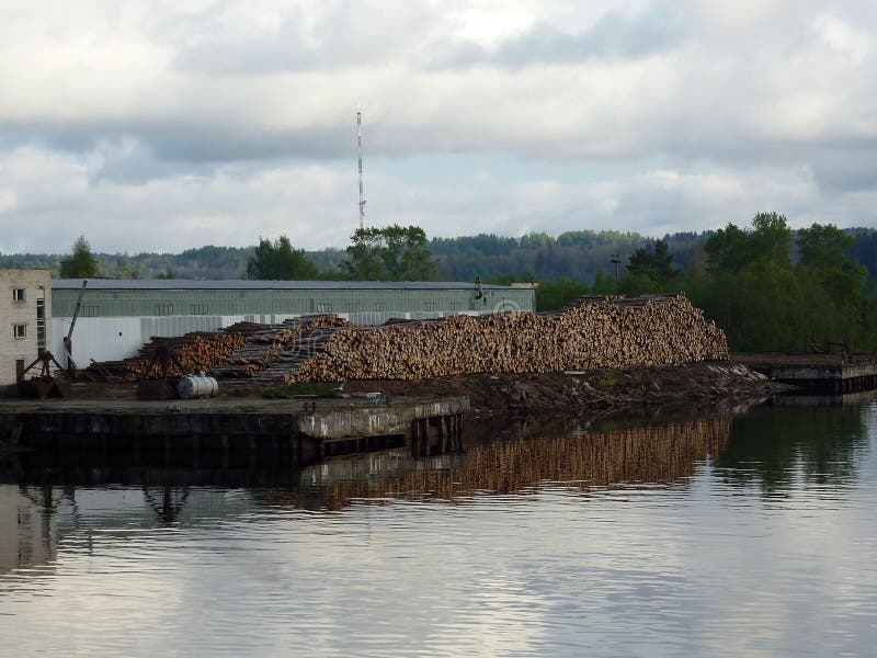 Stored Logs on the River Pier Stock Photo - Image of alloy, clouds ...