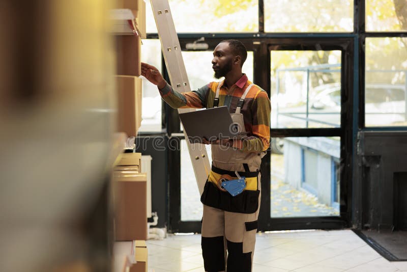 Storehouse Manager Looking at Cardboard Boxes Stock Photo - Image of ...