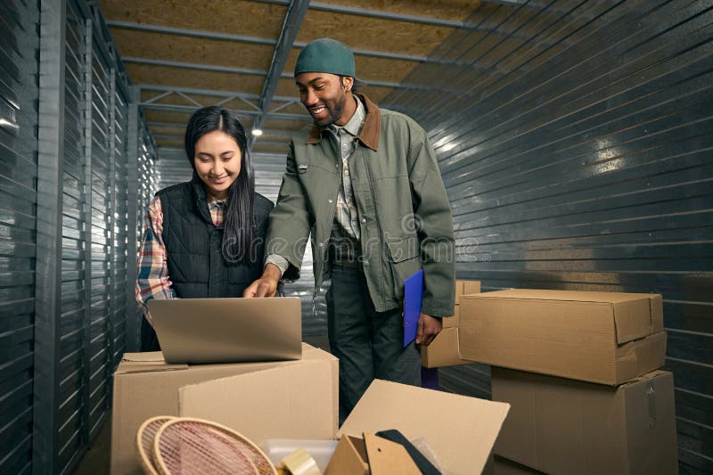 Storehouse Workers Involved in Containerizing Boxed Goods Stock Image ...