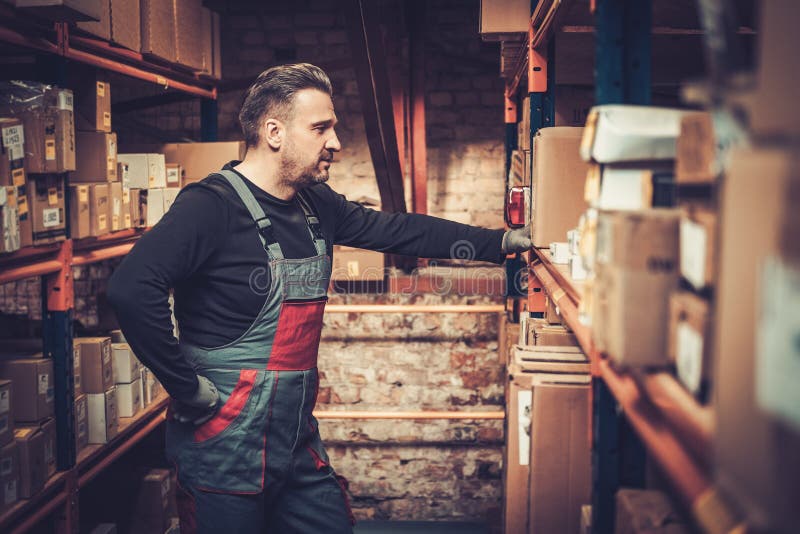 Storekeeper Looking for Exact Goods on a Warehouse Stock Image - Image ...